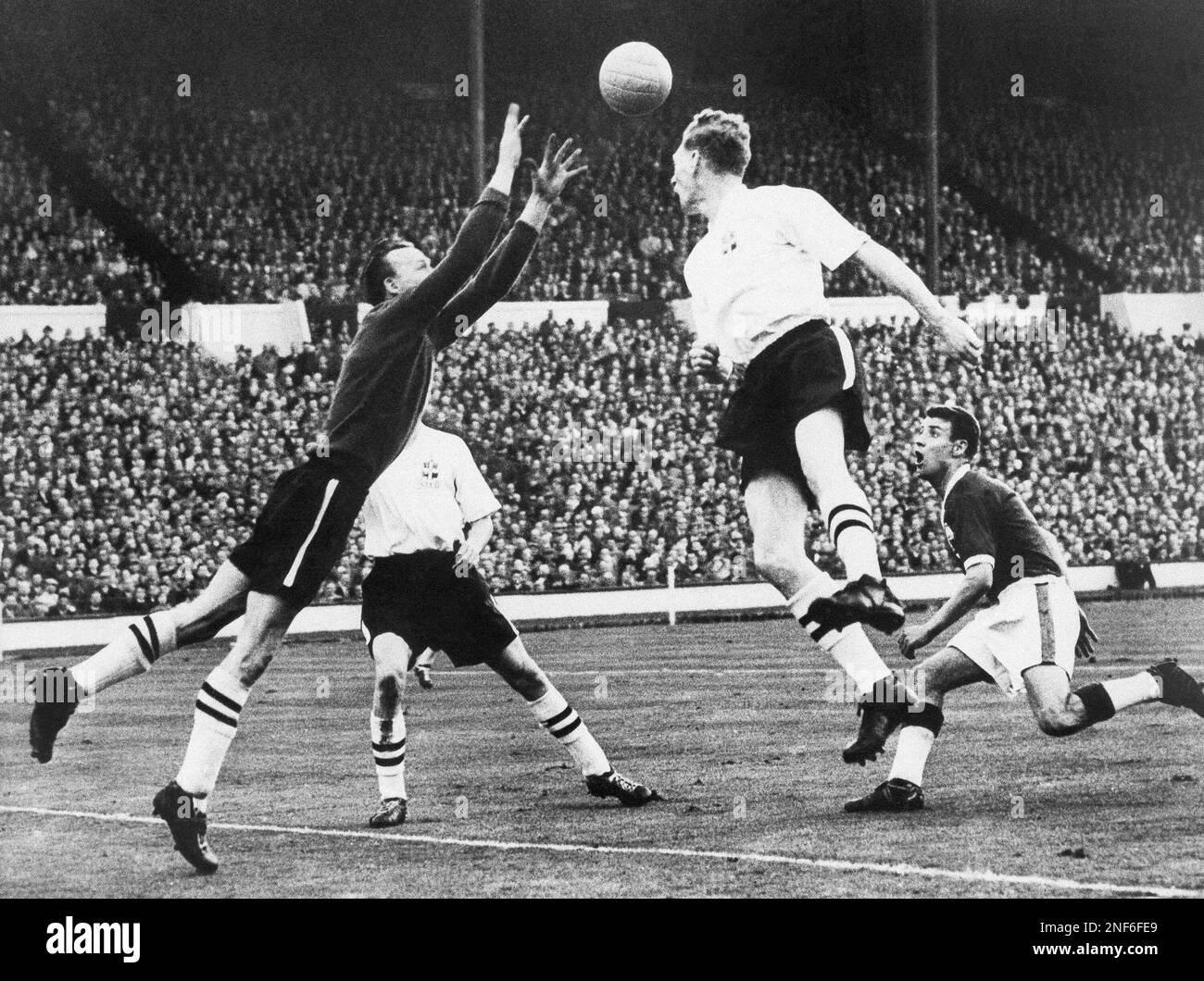 Luton Town's goalie Ron Baynham, left, and his centerhalf, Sid Owen ...