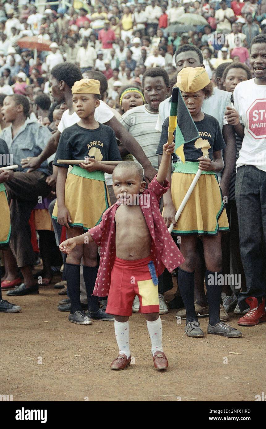 A child waves an African National Congress flag at a rally on Sunday ...