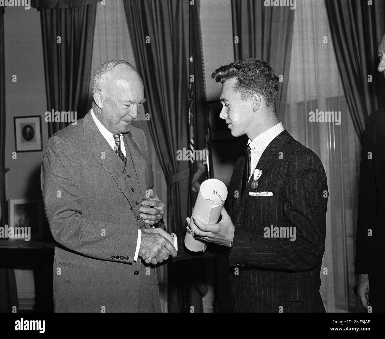 William Steury of Bluffton, Ind., is congratulated by President Dwight ...
