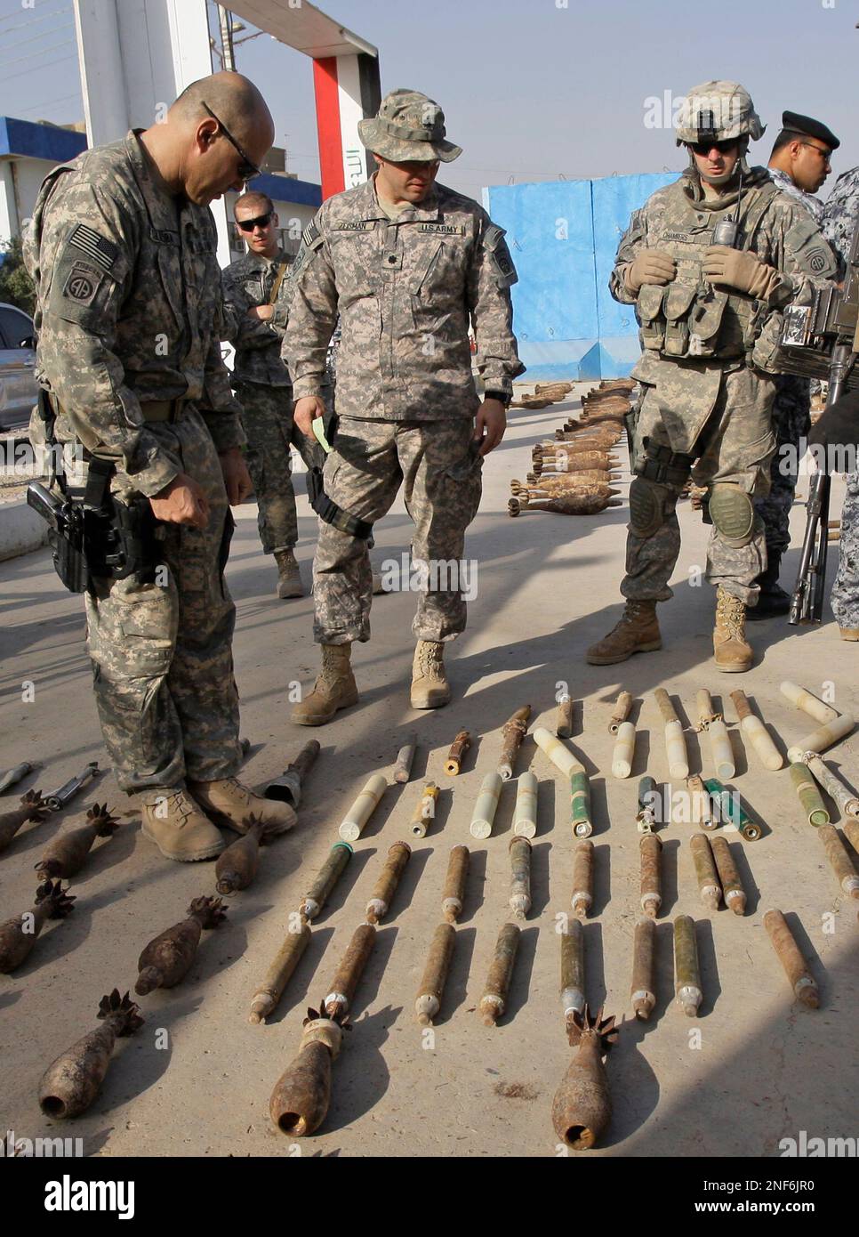U.S. Army soldiers check weapons seized by Iraqi security forces during ...