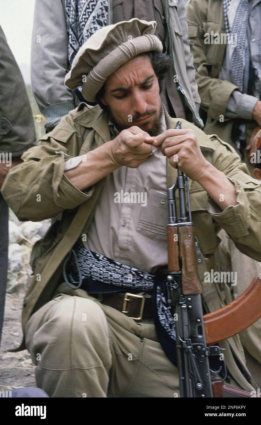 Legendary guerrilla Ahmad Shah Massoud repairs a captured Soviet ...