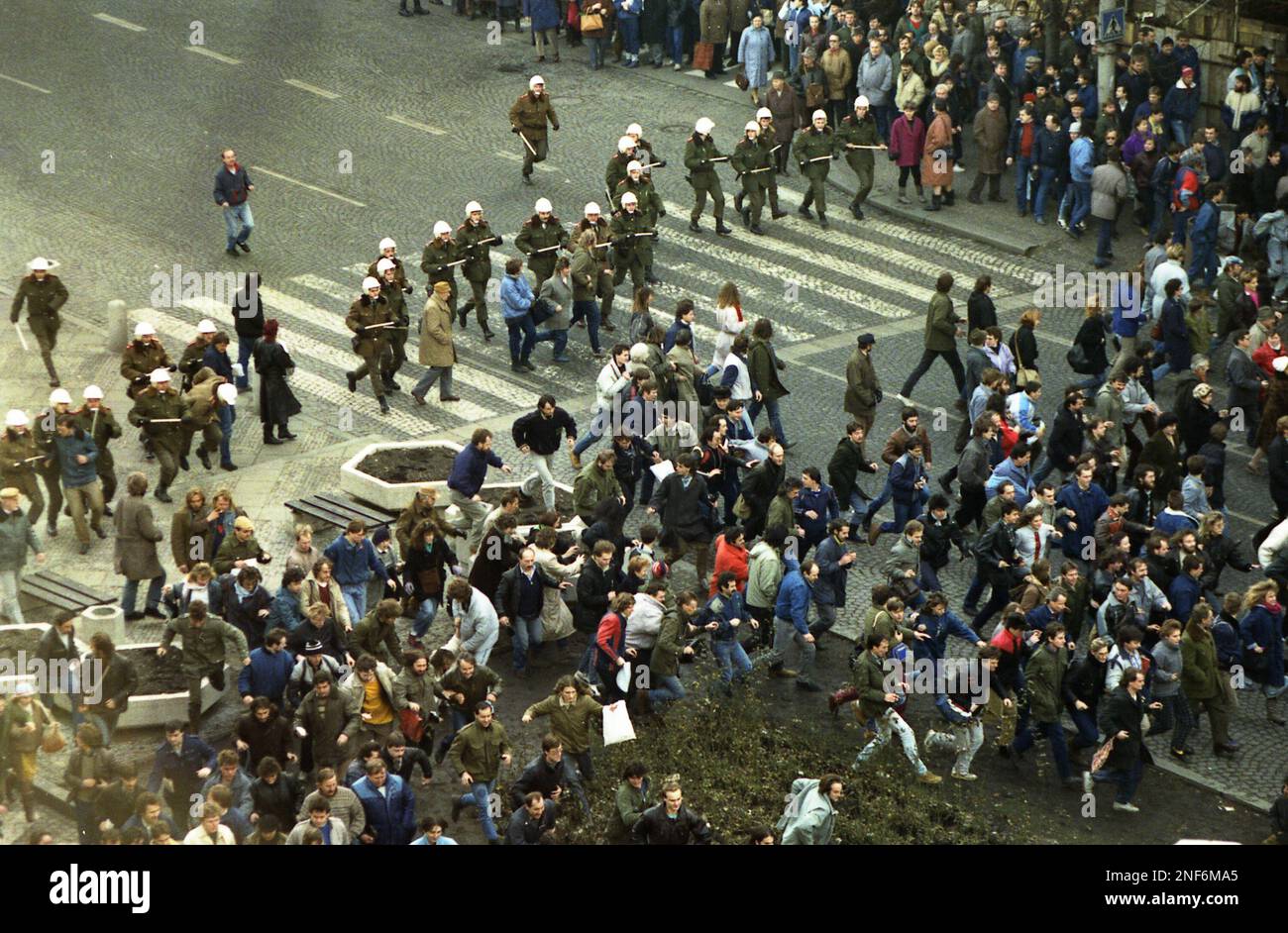 Riot police officers try to disperse demonstrators at Prague's ...