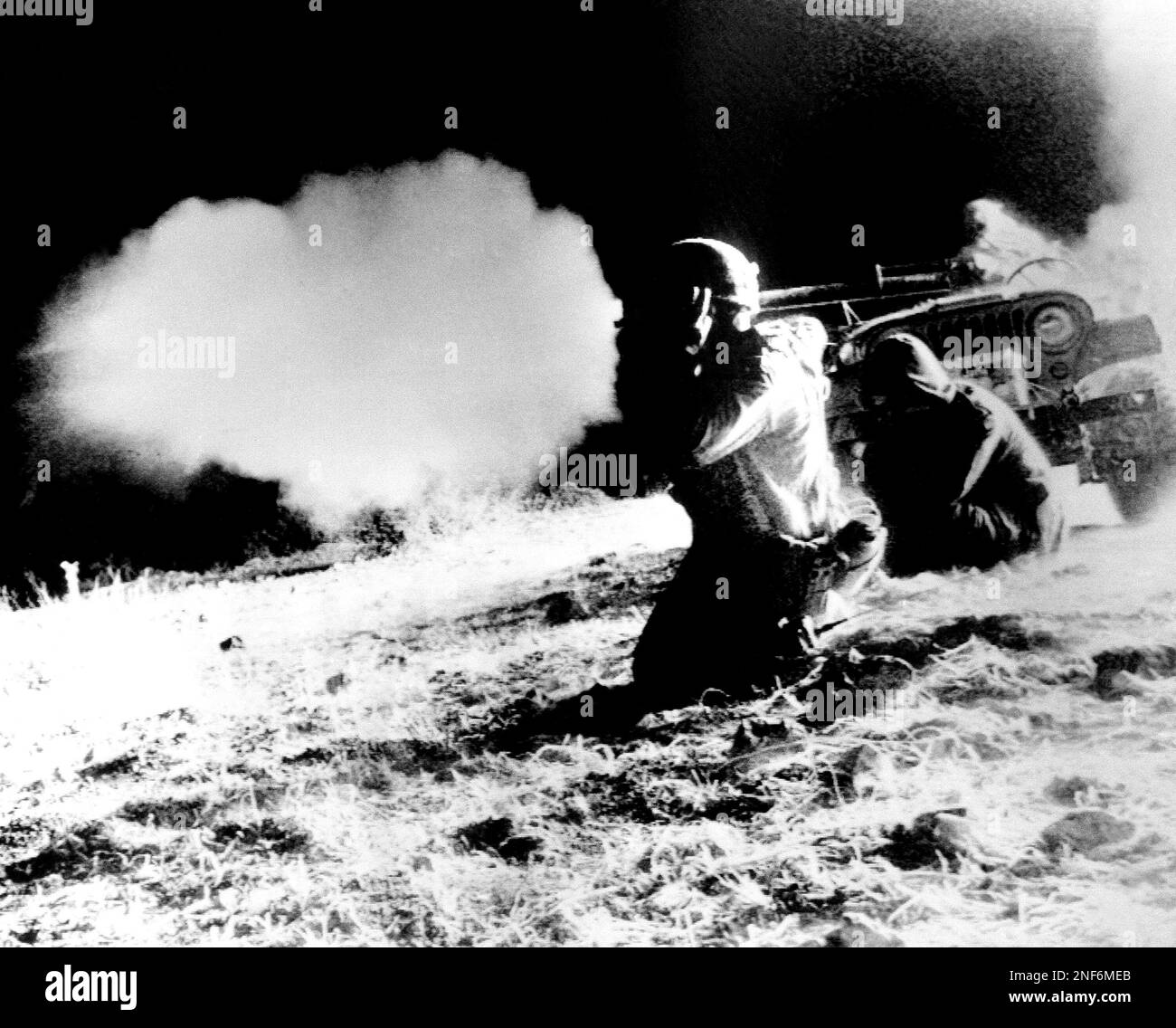 Israeli troop hold hands to ears as a jeep mounted recoilless rifle is ...