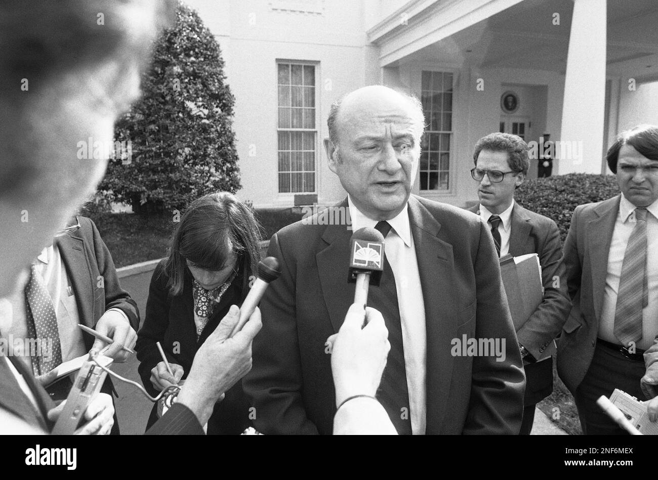 New York City Mayor Ed Koch is interviewed by reporters outside the ...