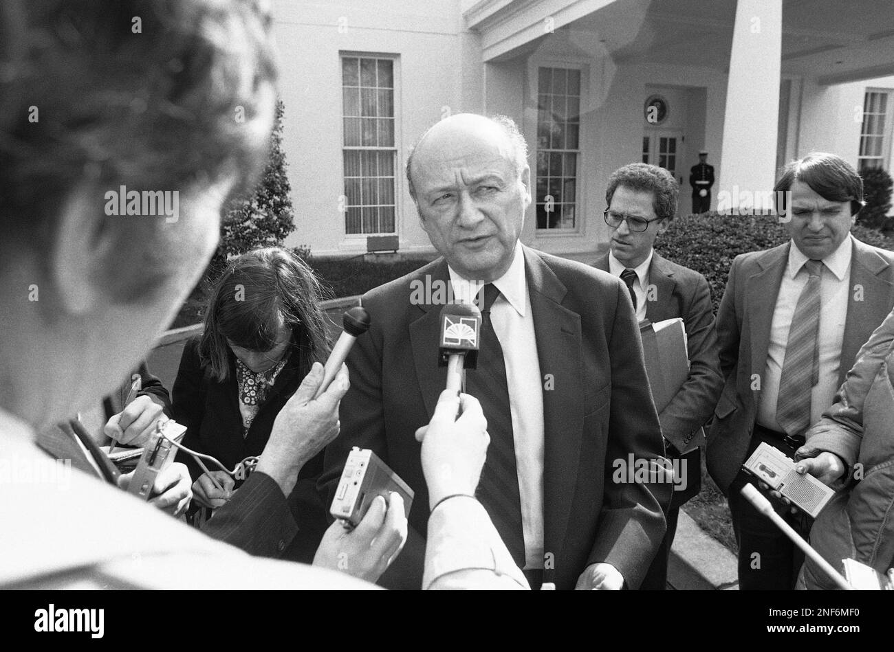 New York City Mayor Ed Koch is interviewed by reporters outside the ...