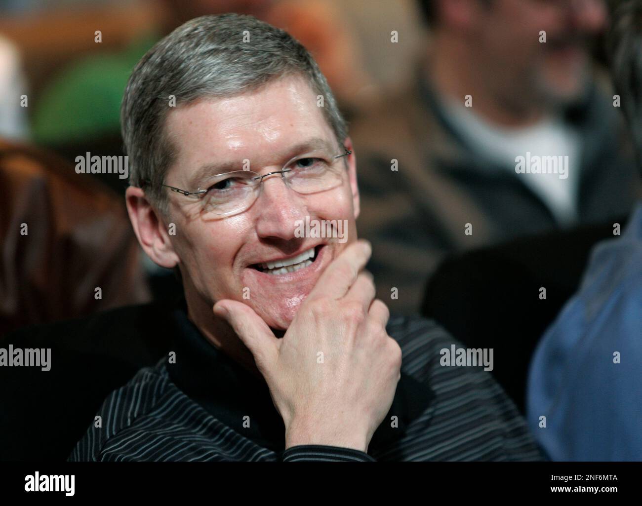 Timothy D. Cook, Apple’s chief operating officer, smiles during a ...