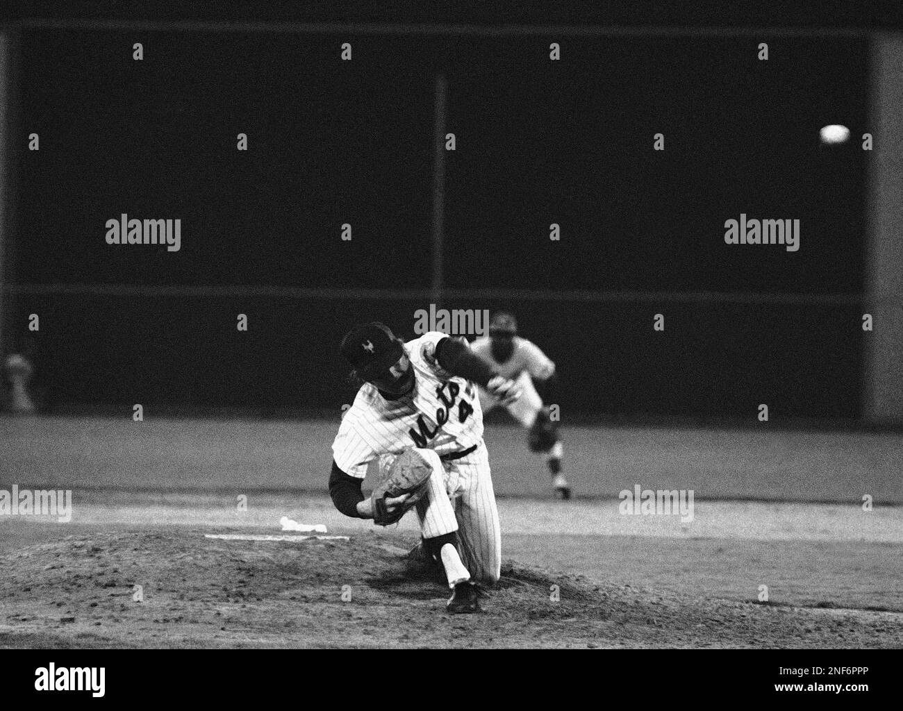 New York Mets pitcher Tug McGraw goes to his knee as he hurls in the ...