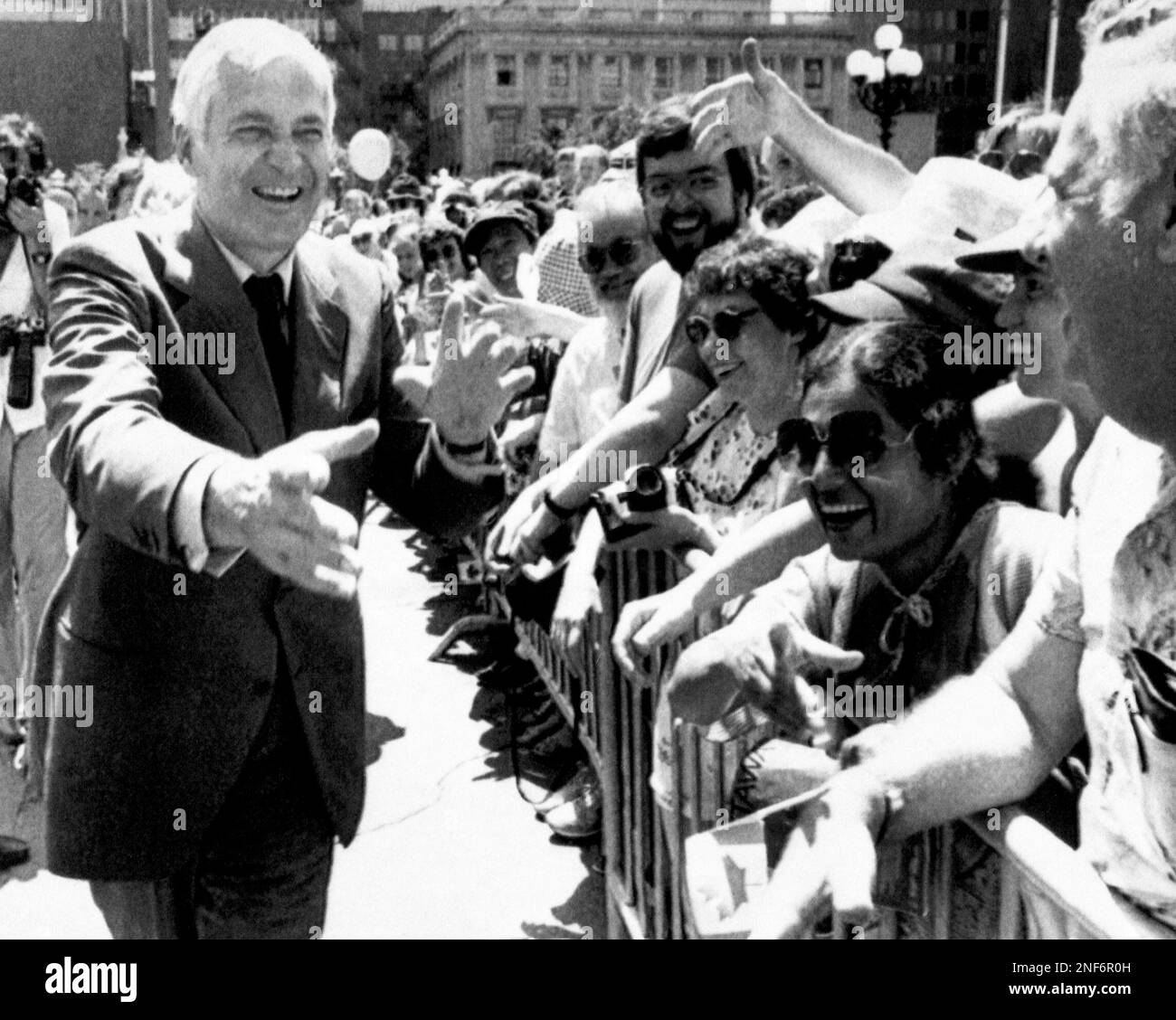 Prime Minister John Turner reaches out to tourists assembled on ...