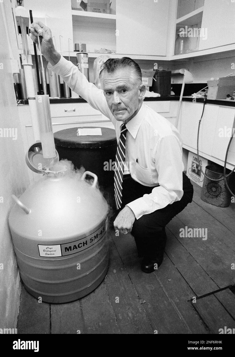 Robert K. Graham displays a container holding the sperm of one of his ...