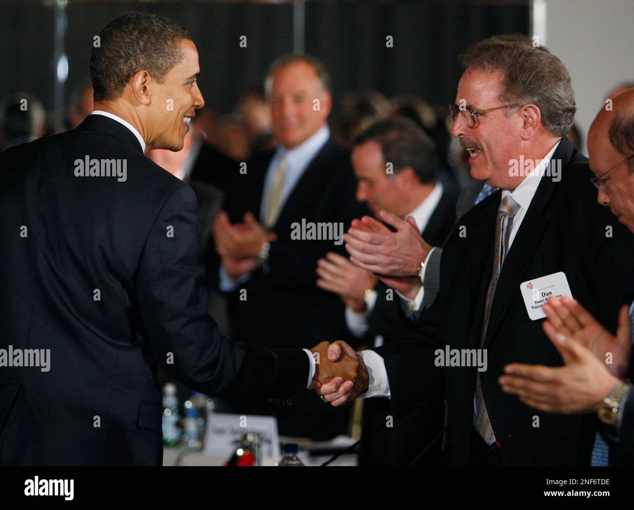 President Barack Obama greets Dan DiMicco, Chairman, Chief Executive ...
