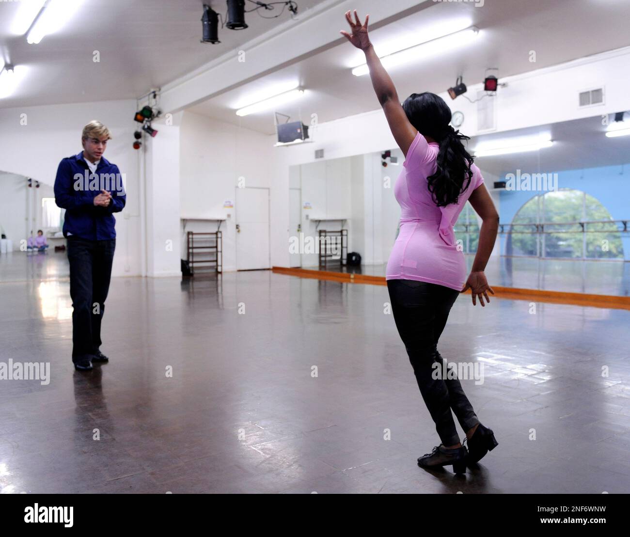 "Dancing With the Stars" contestant Lil' Kim, right, practices a move ...