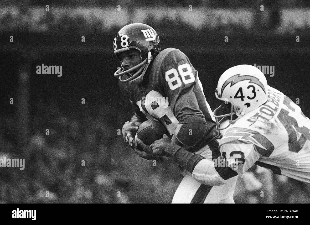 San Diego Chargers Jim Tolbert (43) tries to take the ball from New ...