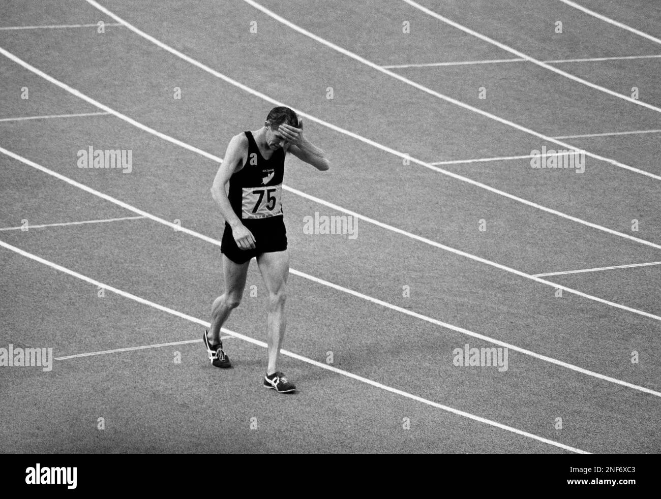 Mike Ryan of New Zealand holds his hands to his for head as he walks ...
