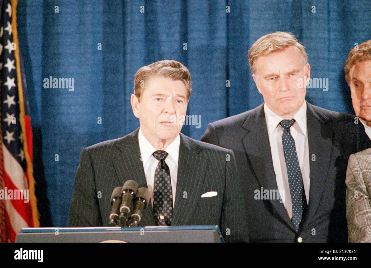 Pres. Ronald Reagan, center, responds to allegations read by American ...