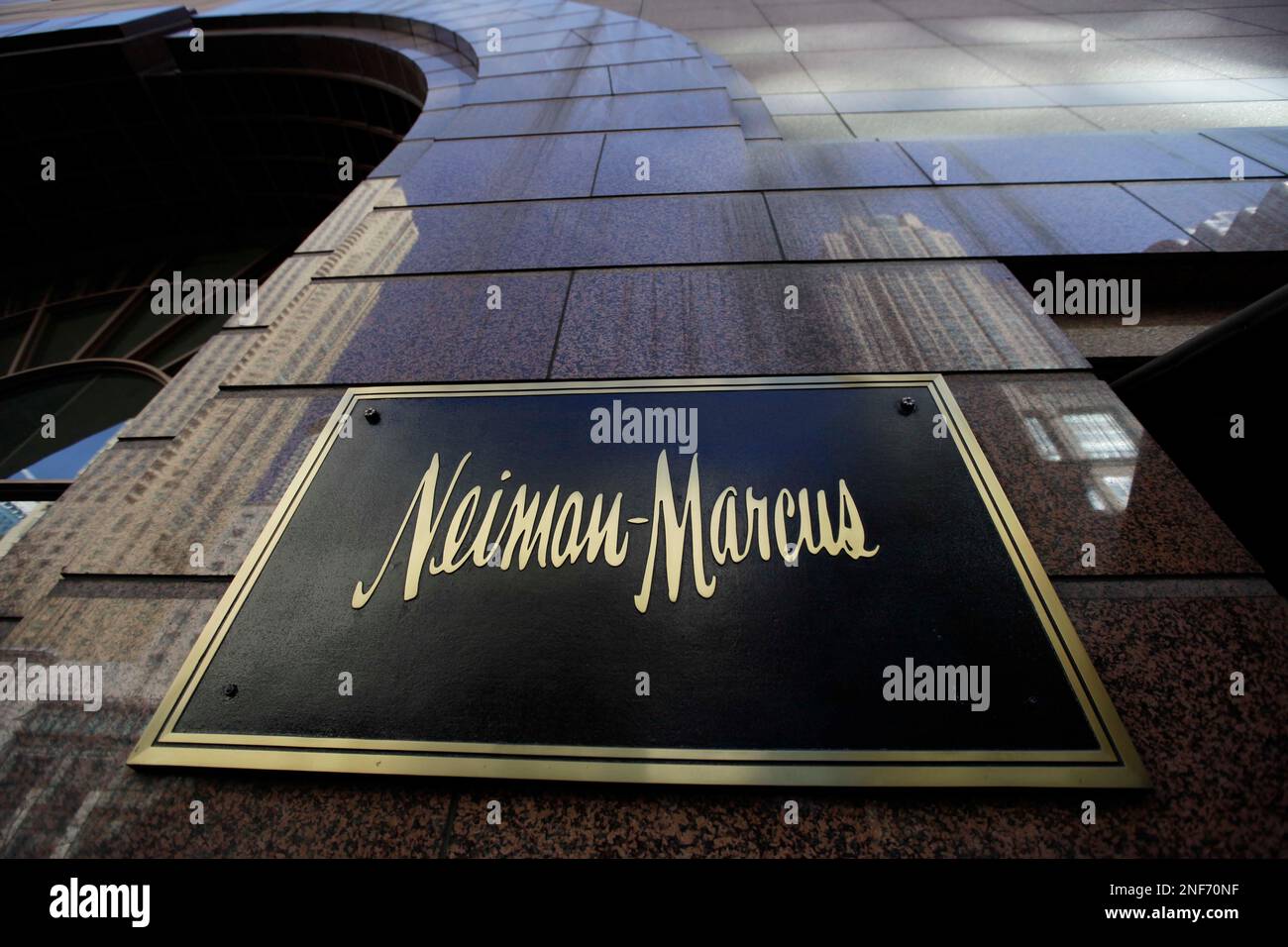 The Chicago skyline is reflected in the exterior of Neiman Marcus on ...