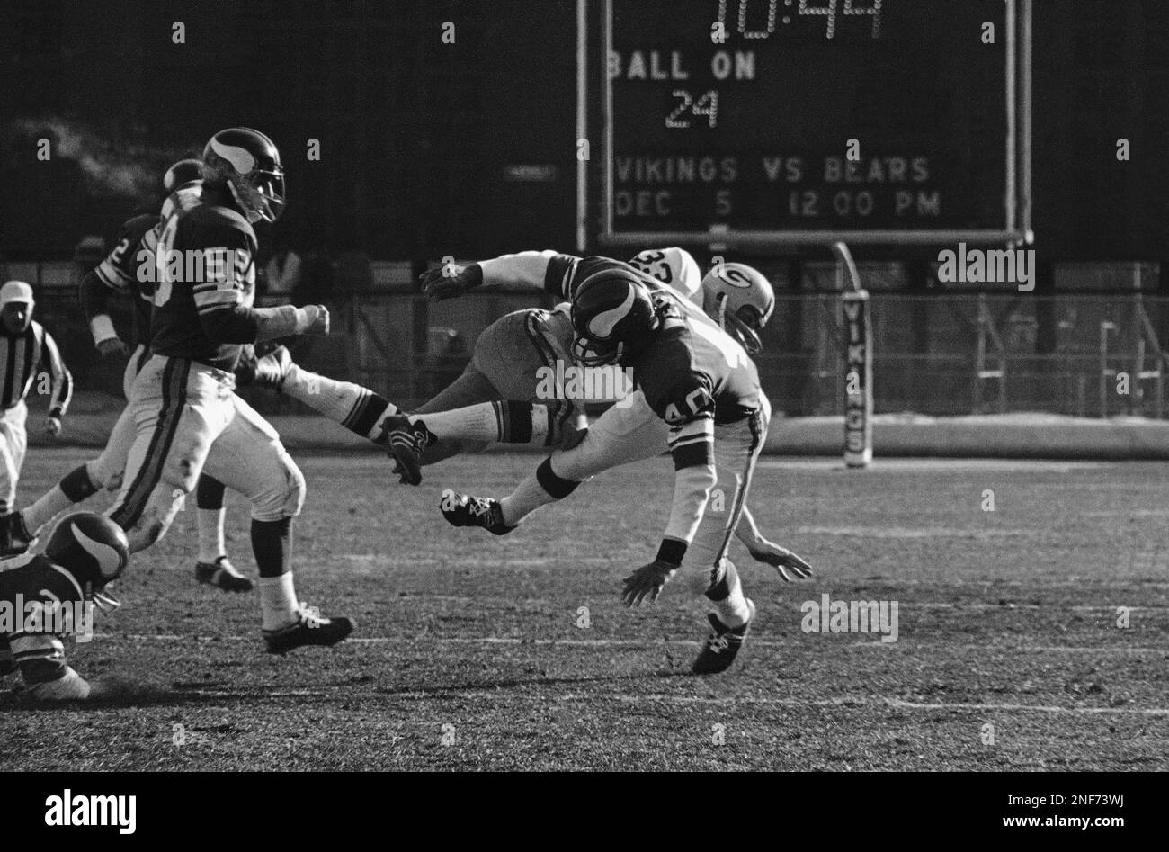 Green Bay Packers ball carrier Jim Grabowski (33) flys behind Minnesota ...
