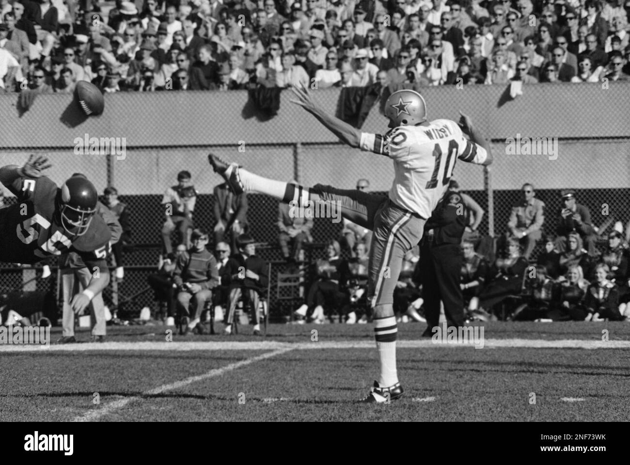 Mike McGill (55), top photo, deflects punt by Dallas kicker Rom Widby ...