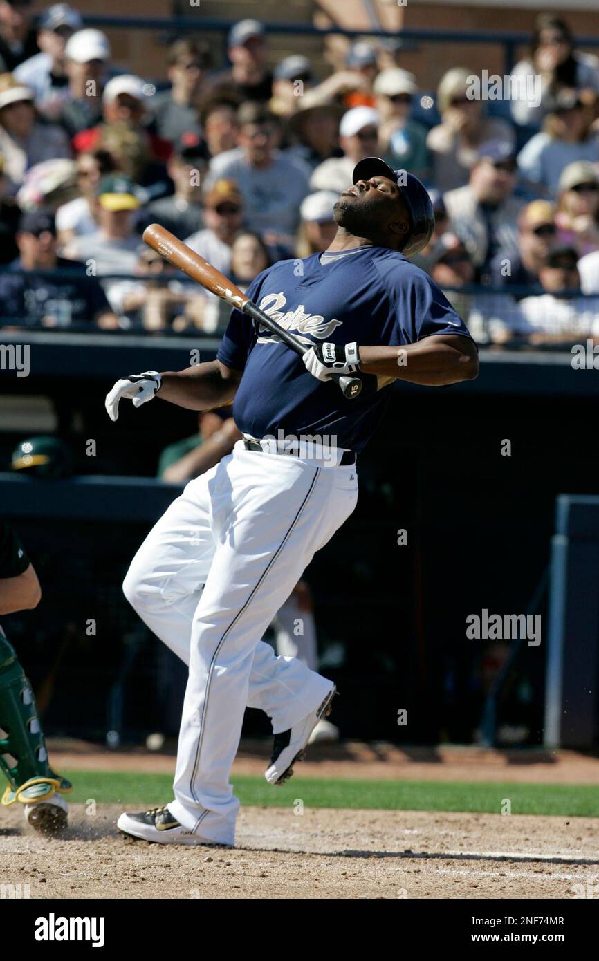 San Diego Padres' Cliff Floyd reacts to being hit by a pitch during an ...