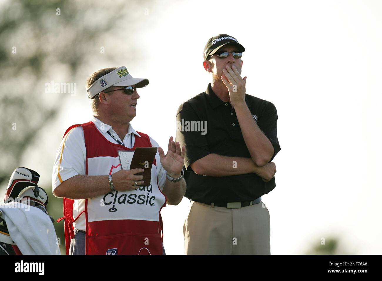 David Mathis, right, talks to his caddie, after dropping two strokes ...