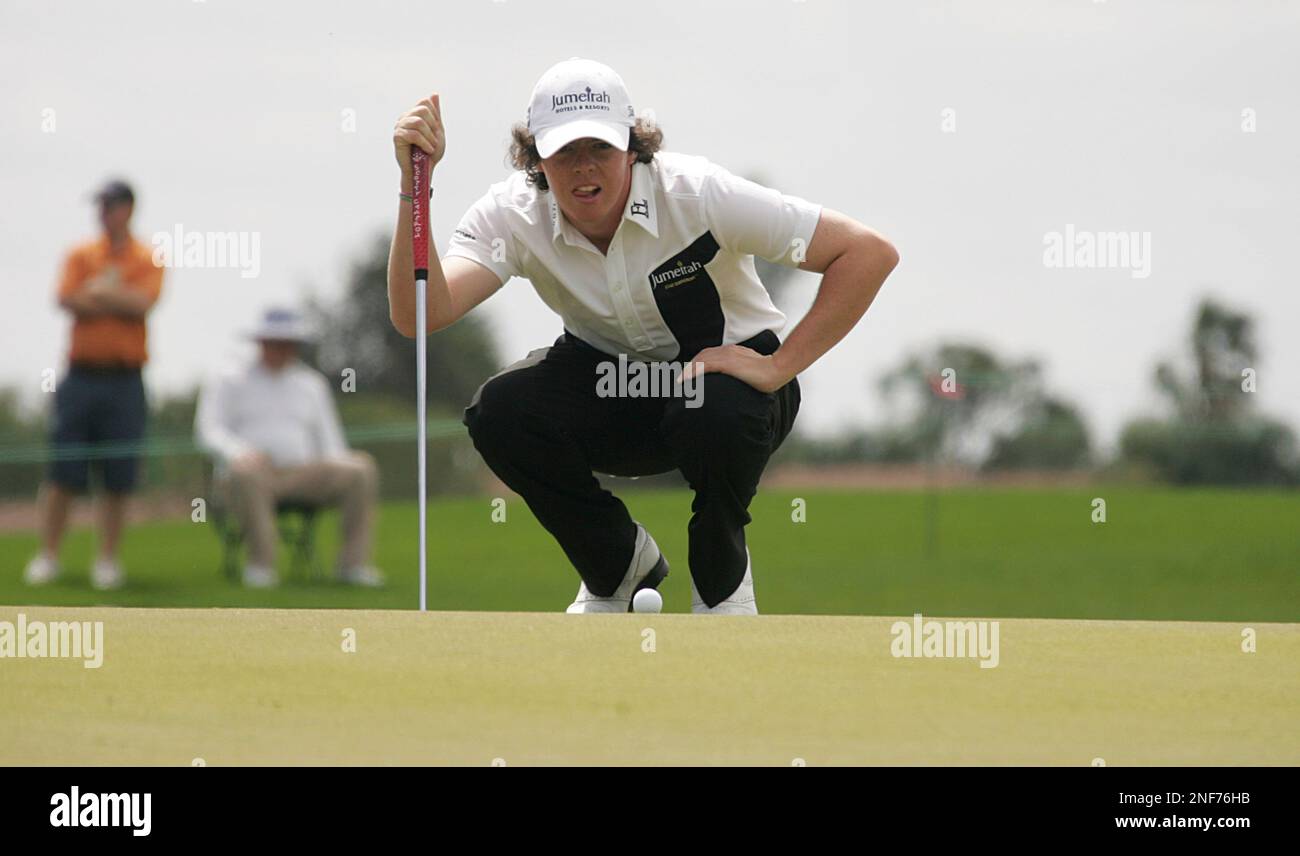 Rory McIlroy studies his putt on the sixth green at the Honda Classic ...