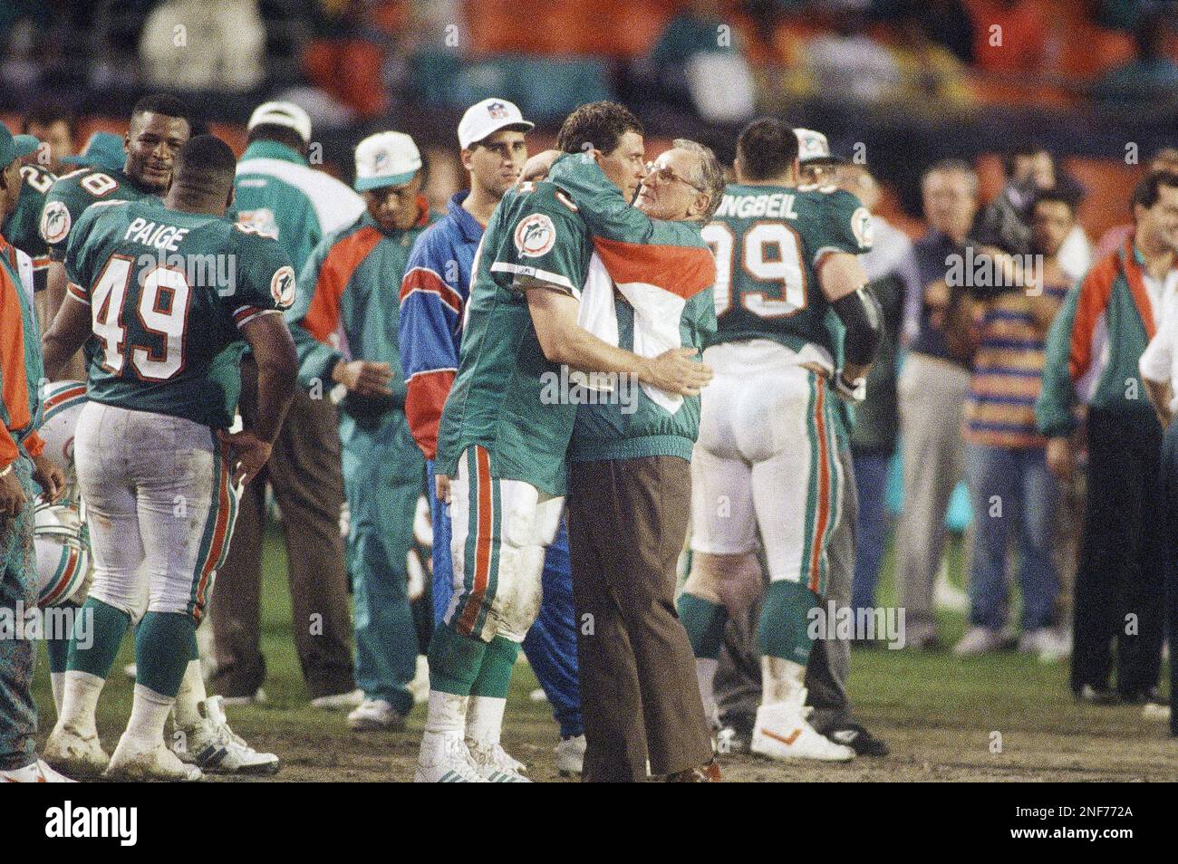 Miami Dolphins coach Don Shula, right, hugs quarterback Dan Marino ...
