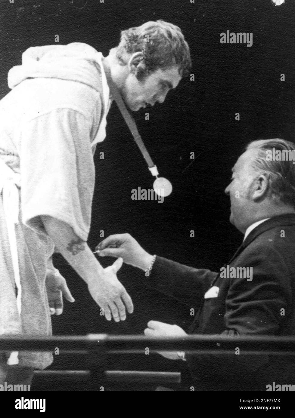 An Olympic official prepares to shake hands with British middleweight ...