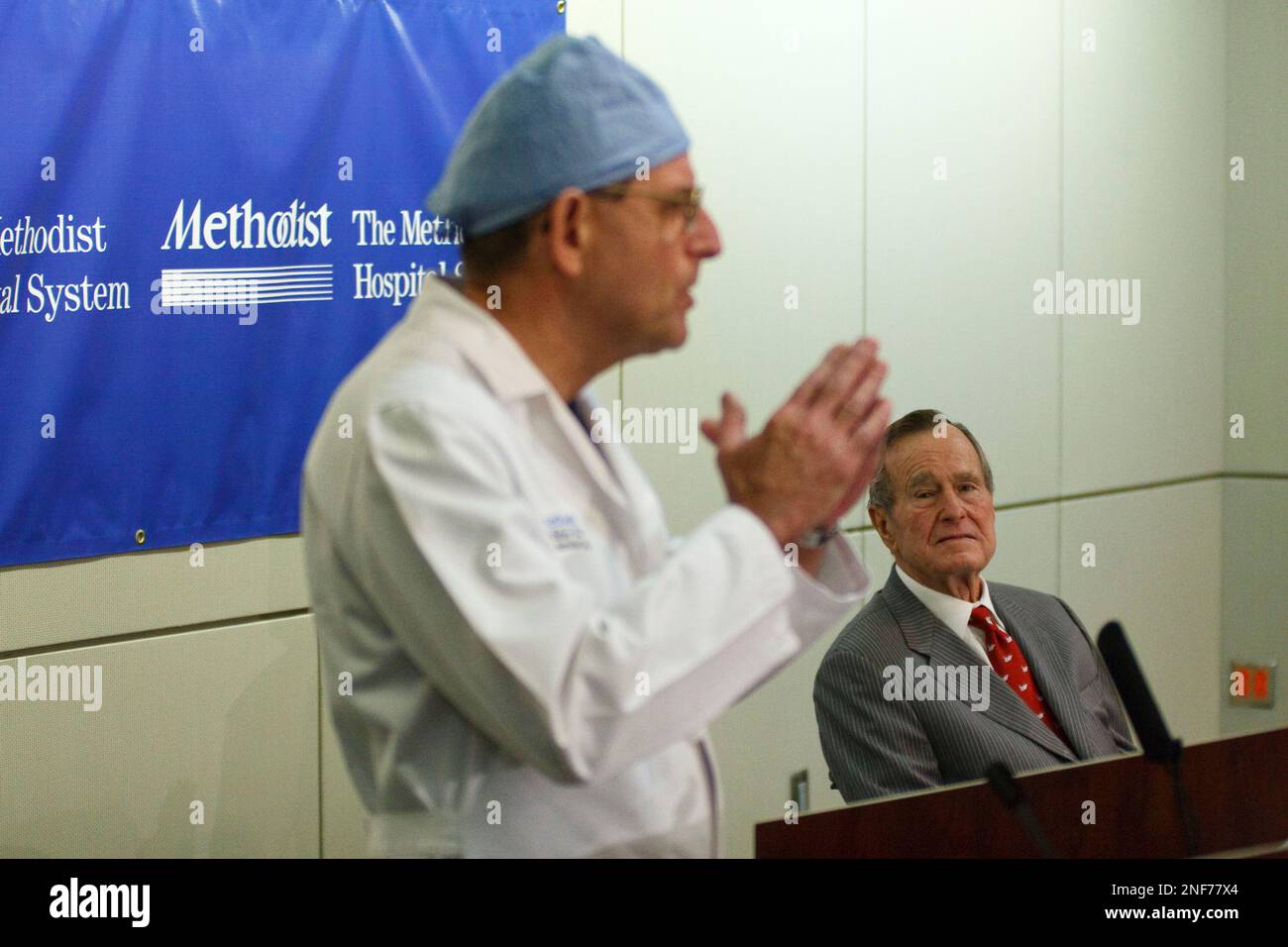 Former President George H W Bush listens to heart surgeon Dr. Gerald ...