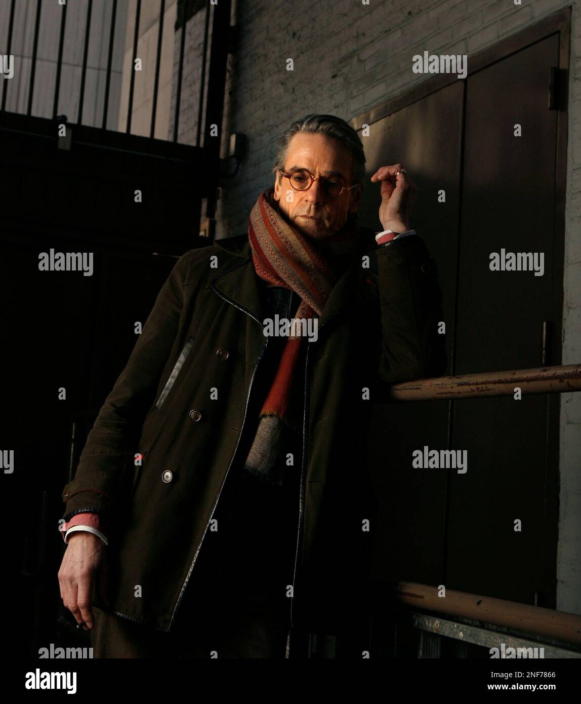 Actor Jeremy Irons poses for a picture in the alley next to the ...