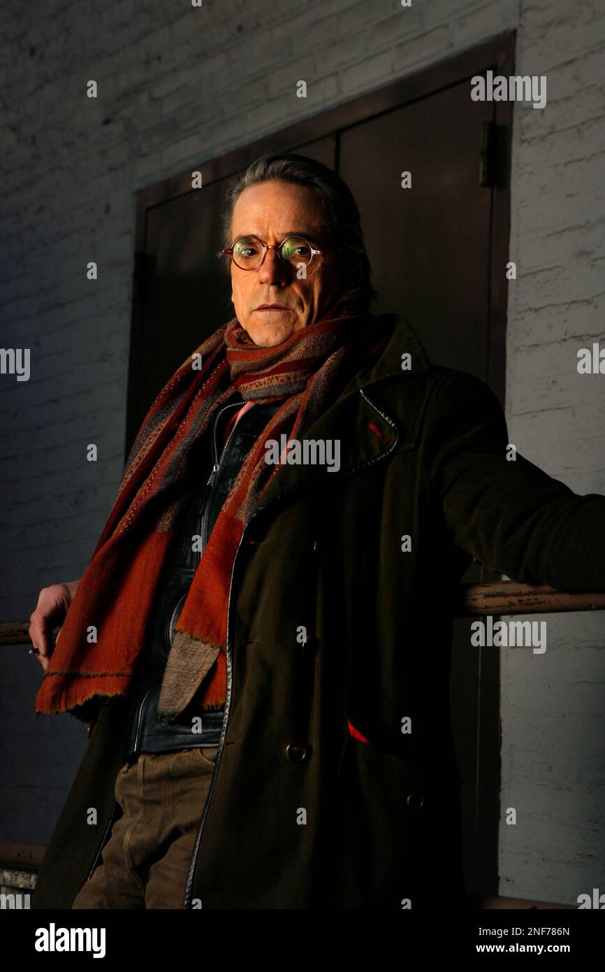 Actor Jeremy Irons poses for a picture in the alley next to the ...