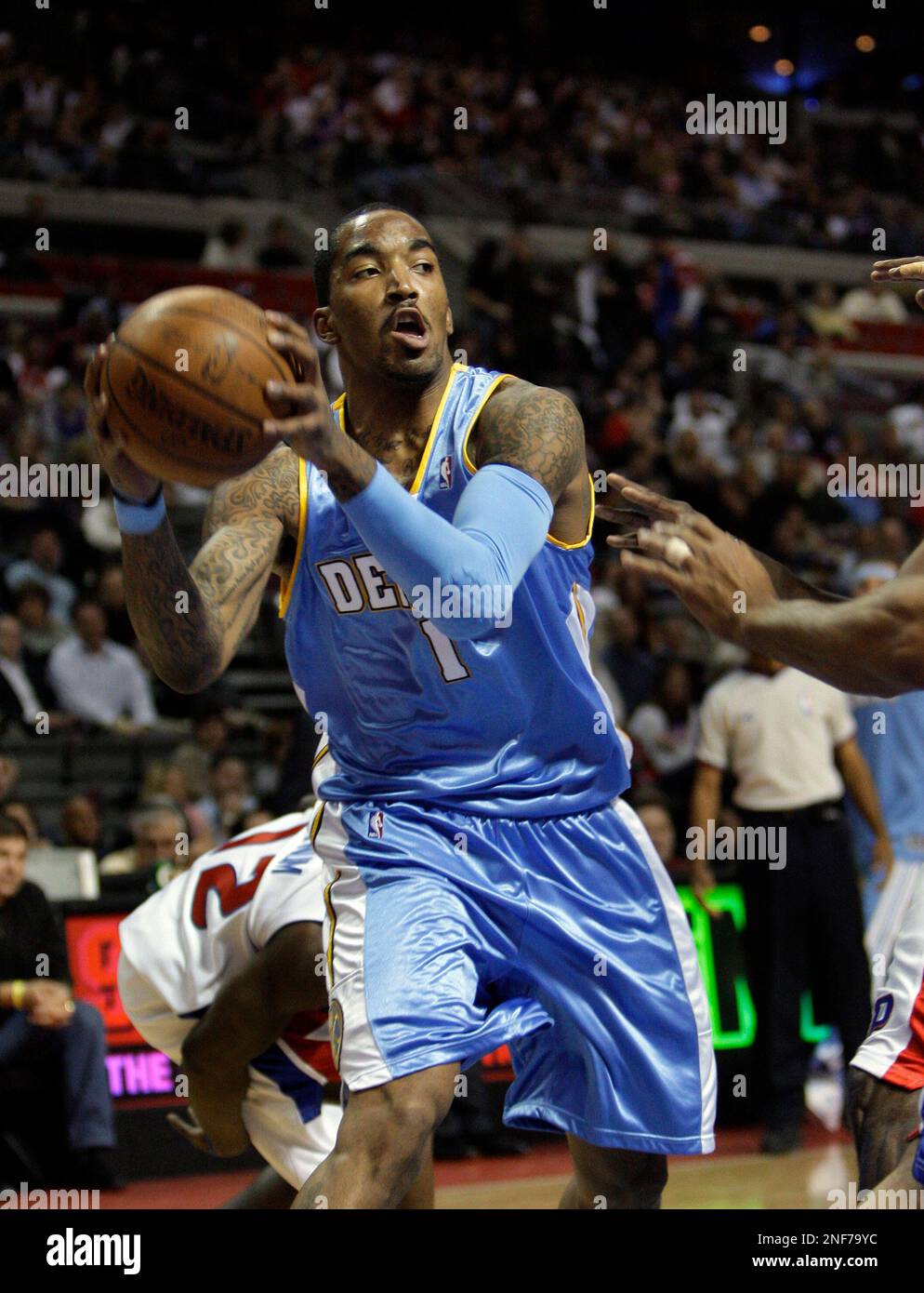 Denver Nuggets guard J.R. Smith drives against the Detroit Pistons in ...
