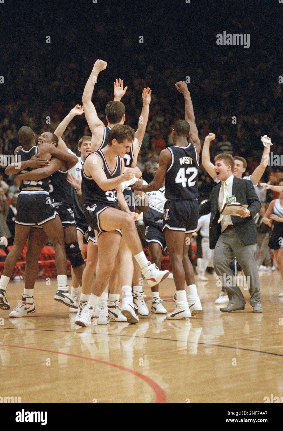 Members of the Villanova Wildcats basketball team react after their 72 ...