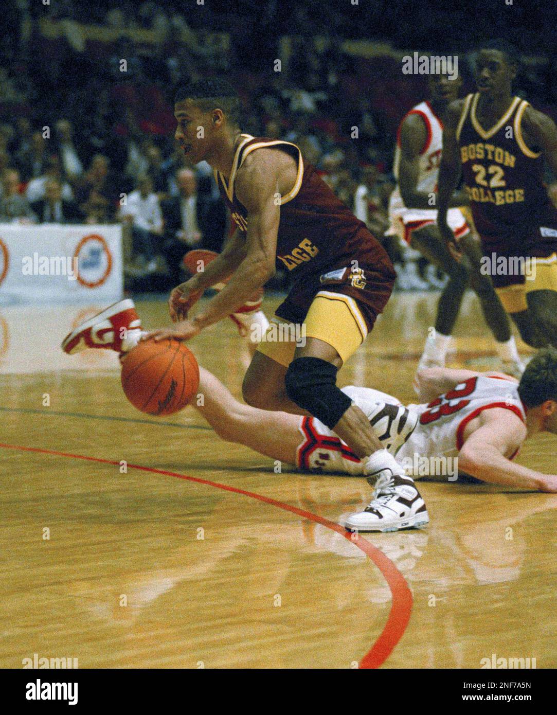 Dana Barros of Boston College drives down court as St. John’s Matt ...