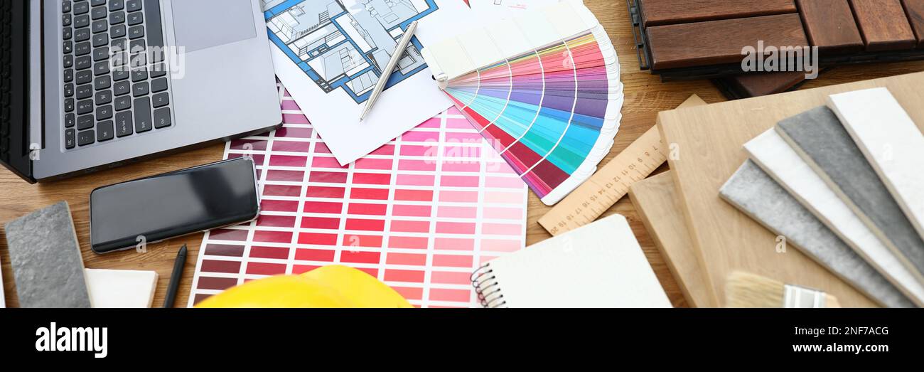 Overhead view of architect workplace drawing floor plan of modern house ...