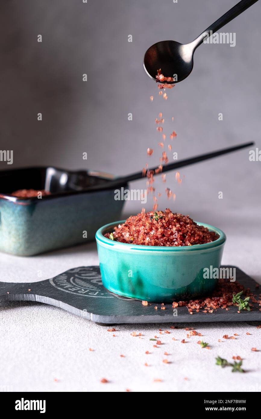 A bowl with homemade red wine infused salt. Condiment to aromatize and ...