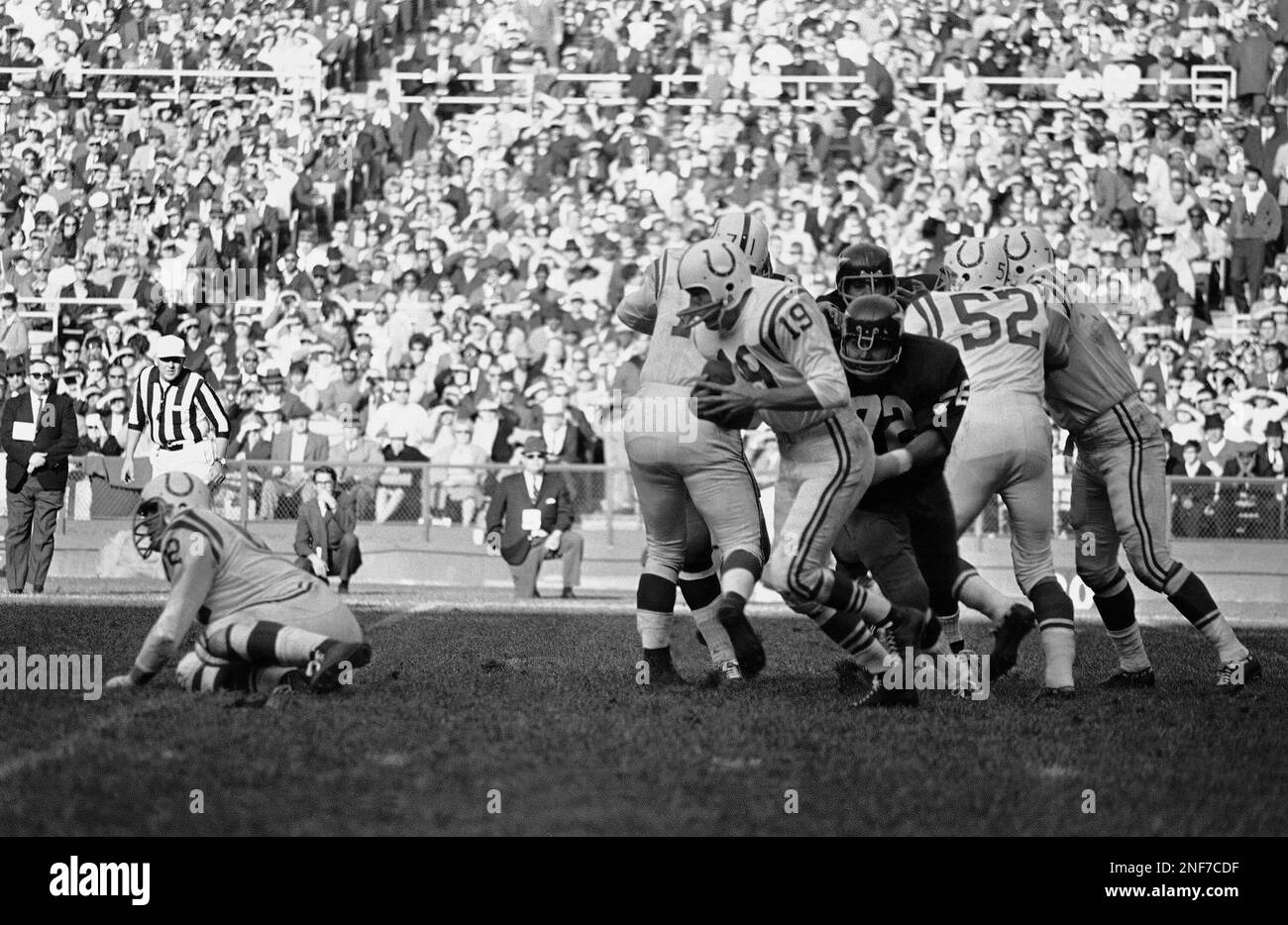 Baltimore Colts quarterback Johnny Unitas (19) runs out of the pocket ...