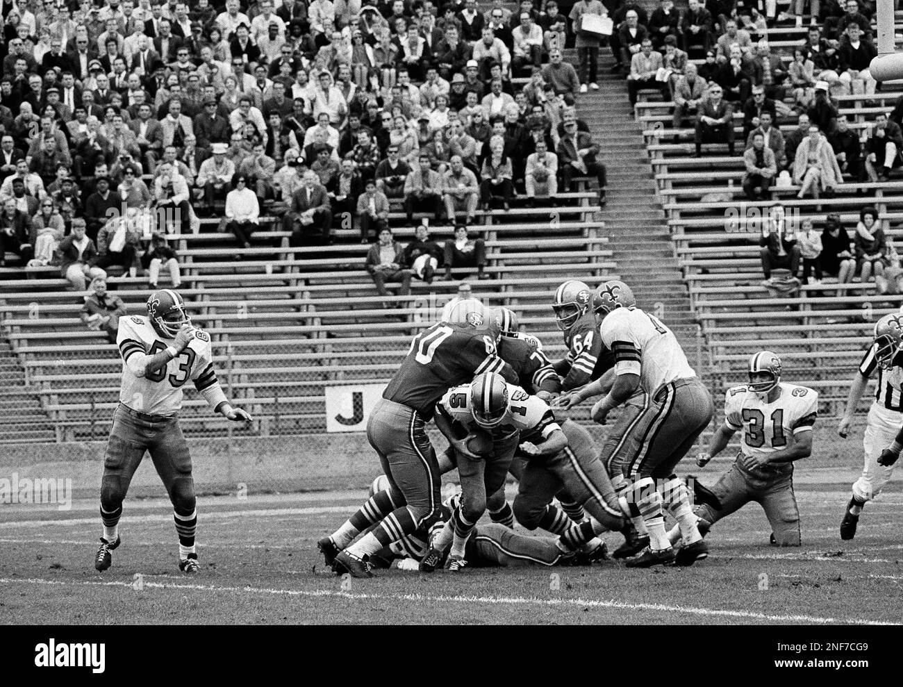 New Orleans Saints quarterback Gary Cuozzo (15) gets smothered for a ...