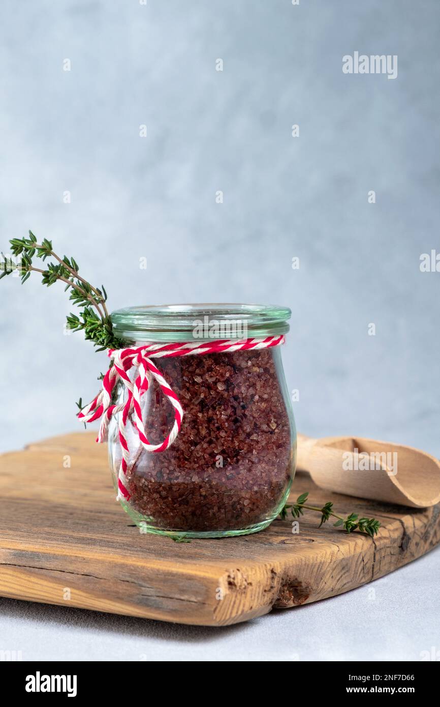 Red wine flavored salt in in a glass jar. Gourmet condiment to ...