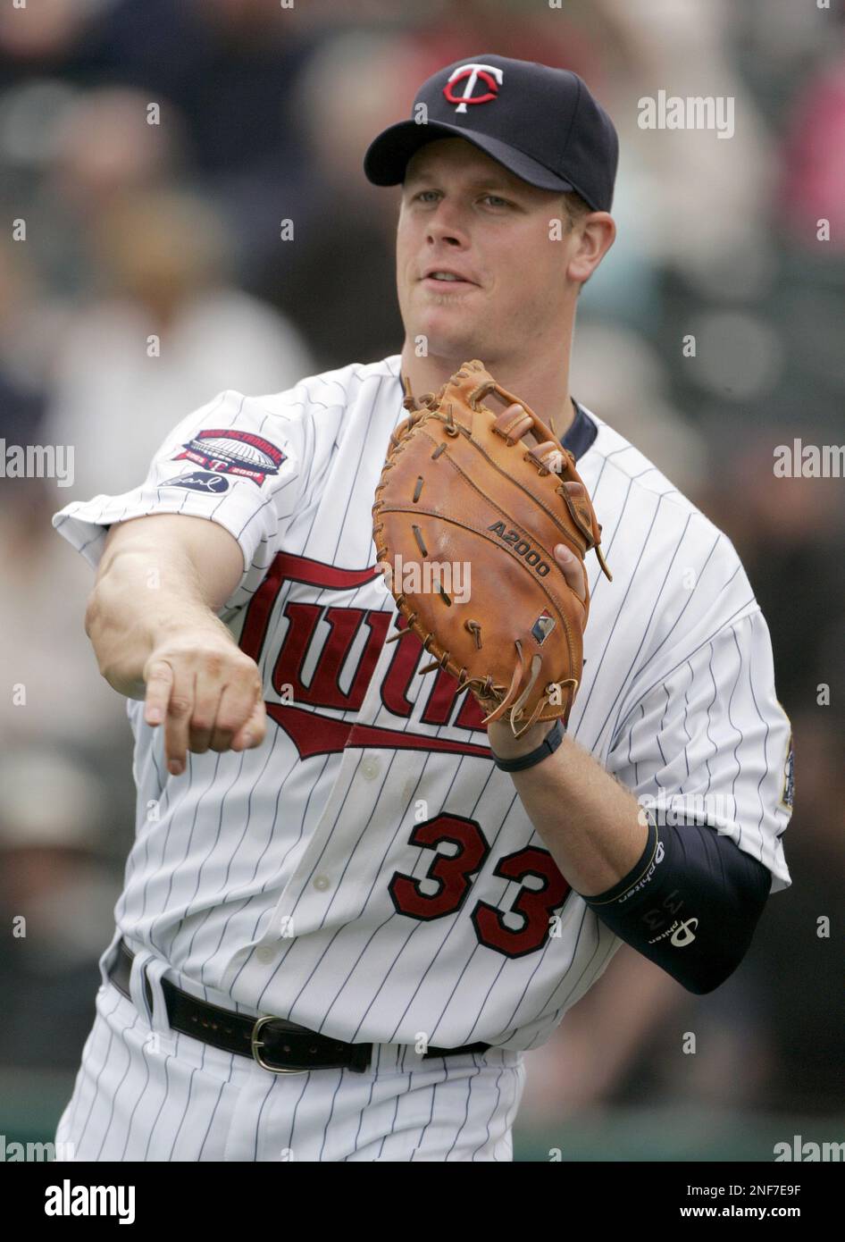 Minnesota Twins' Justin Morneau plays catch while warming up before ...