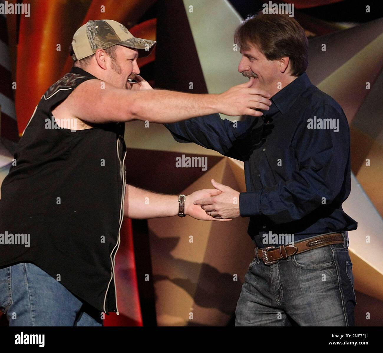 Comedian and roastee Larry the Cable Guy, left, reaches out to hug ...