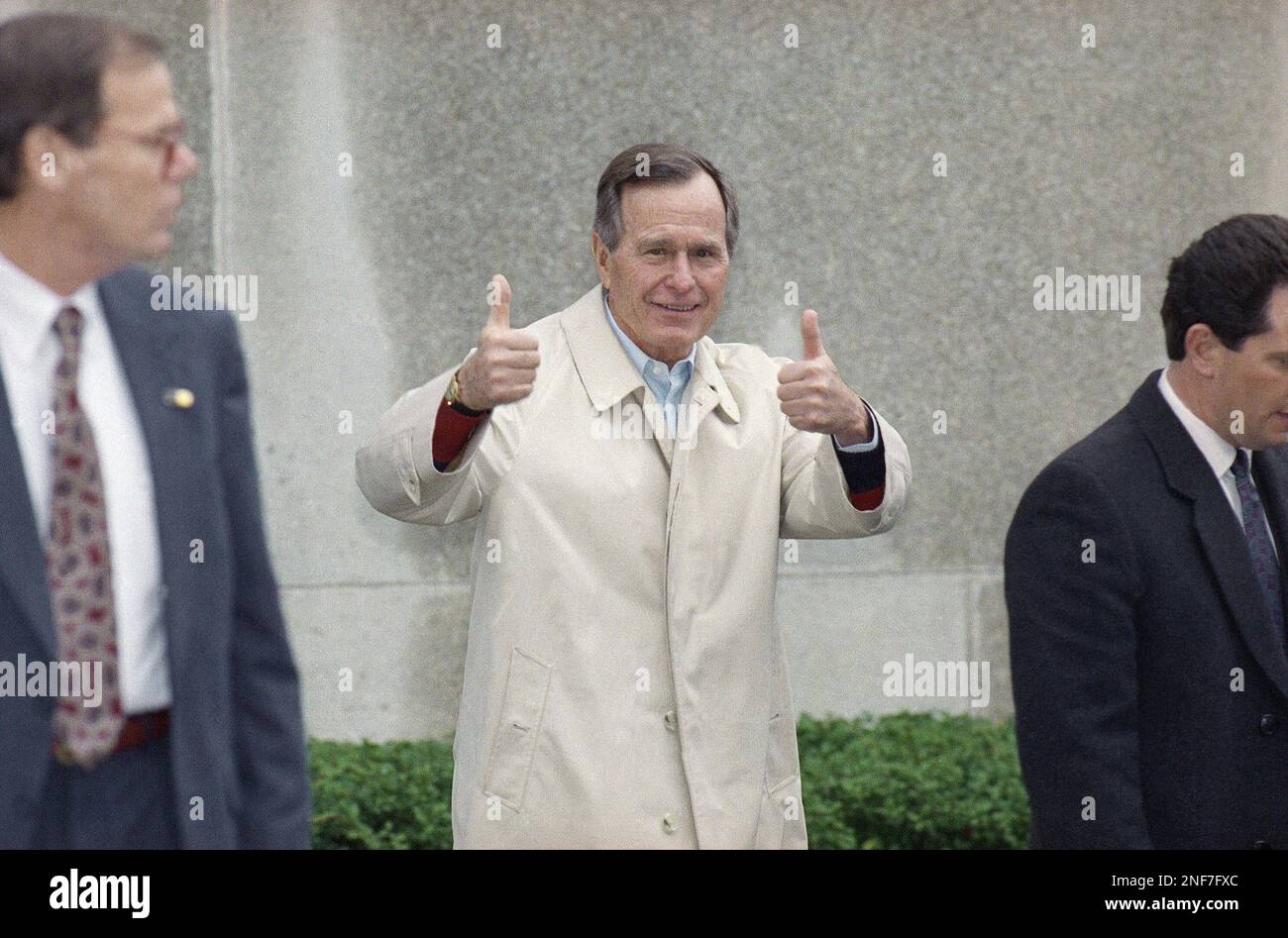 President George H. Bush gives thumbs-up outside Bethesda Naval ...