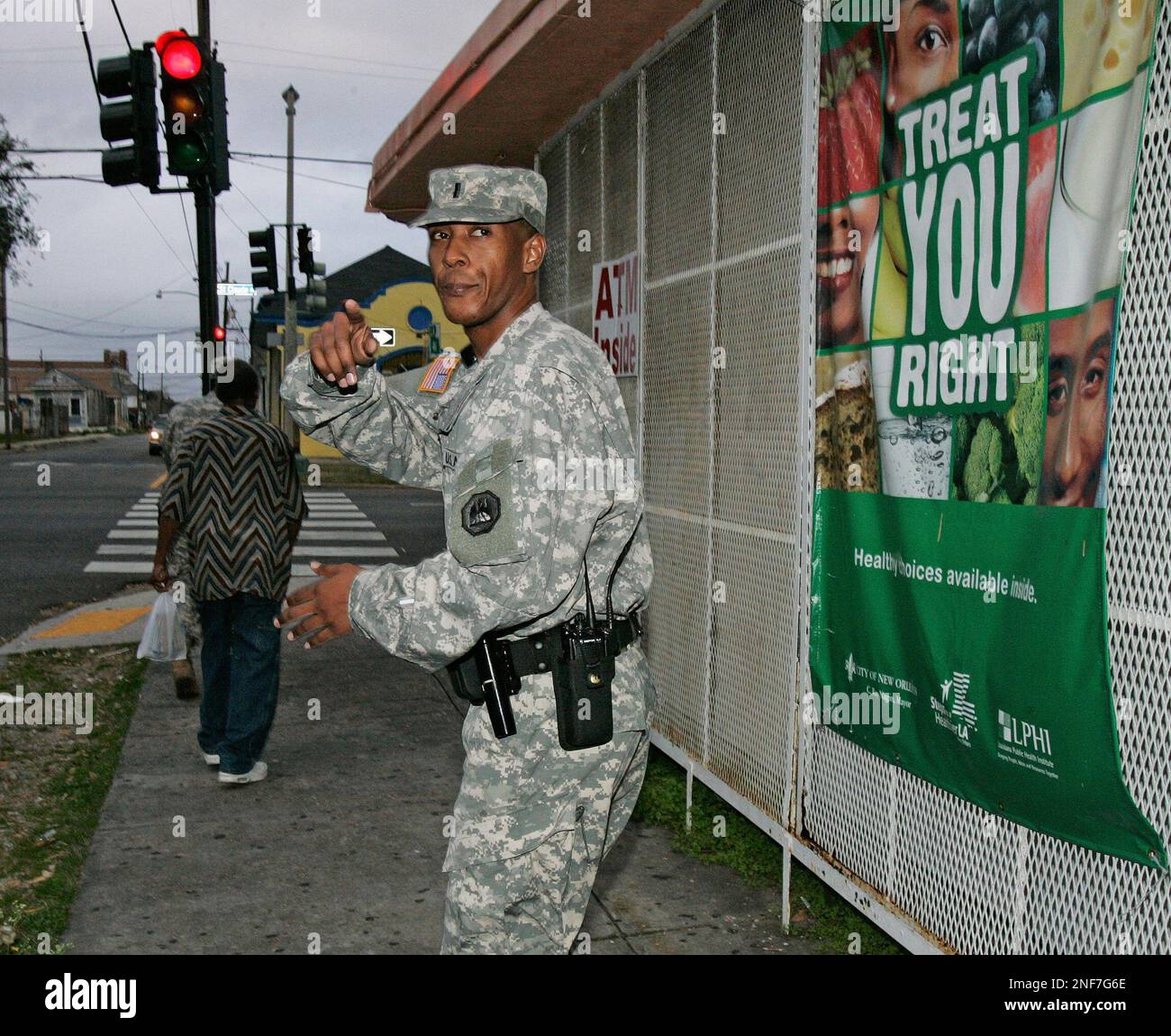 Louisiana National Guard Lt. Ronald Brown, Jr., looks back while ...