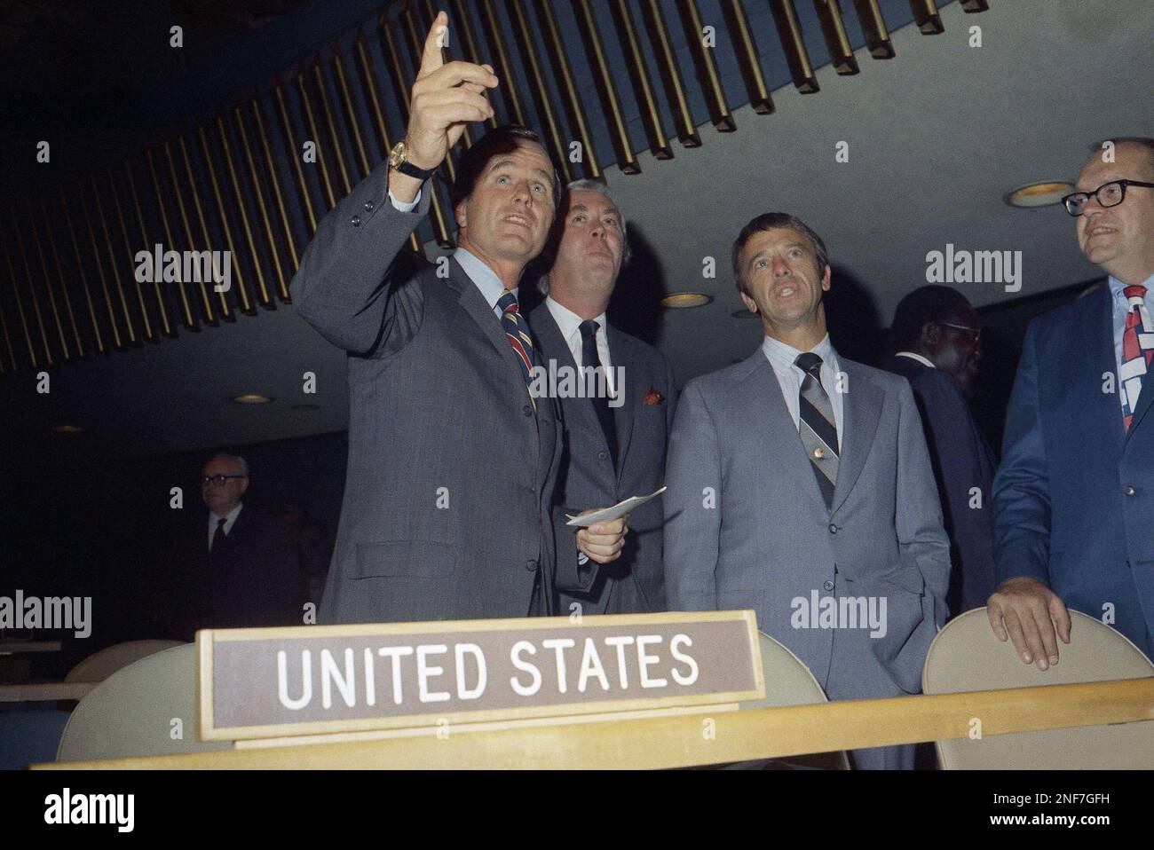 U.S. Ambassador George Bush, points out to Pat Moynihan and Admiral ...