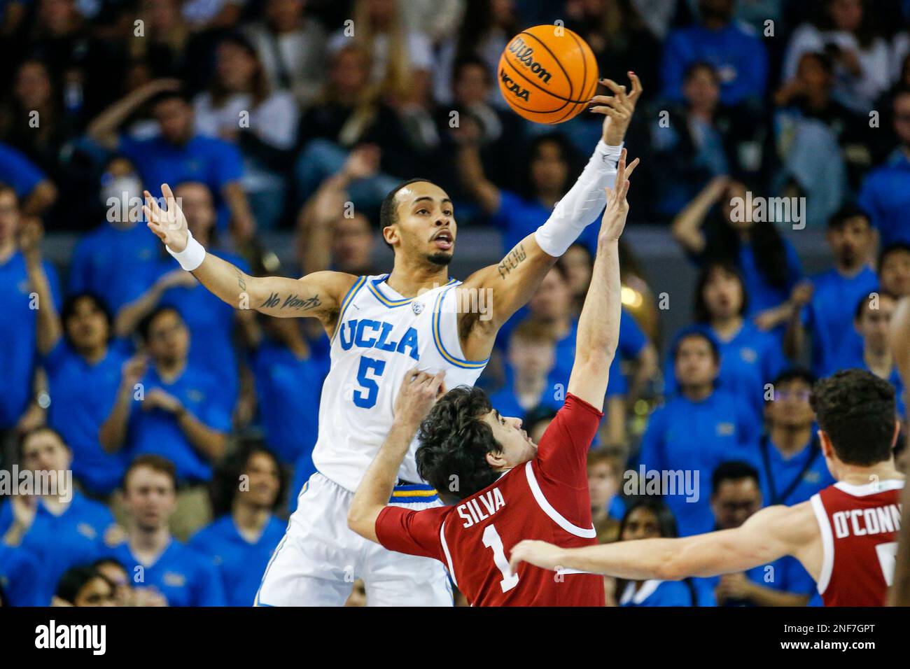 UCLA guard Amari Bailey (5) and Stanford guard Isa Silva (1) fight for ...