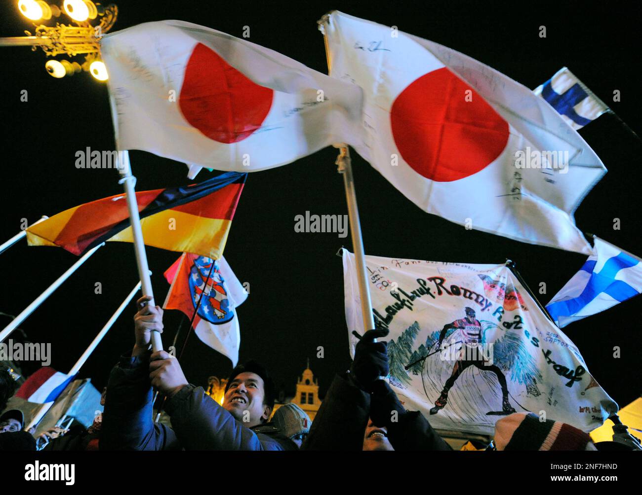 Japanese fans celebrate with their country's flag during the medal ...
