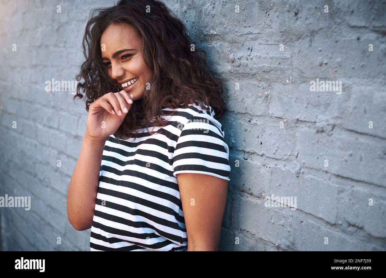 Sometimes a good laugh is a mighty good thing. a cheerful young woman ...