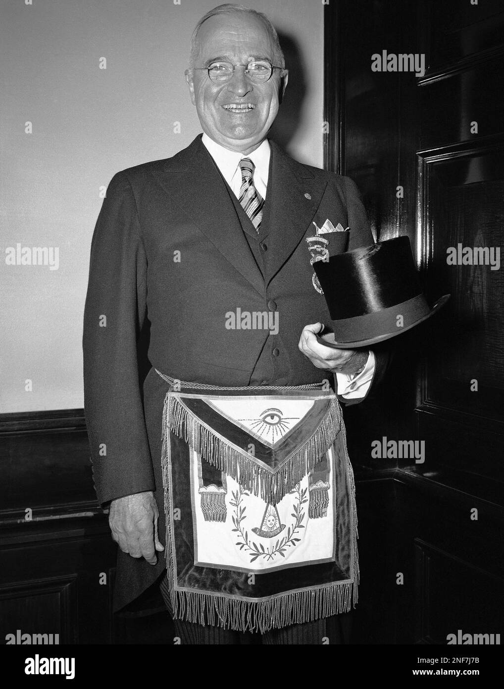 President Harry S. Truman, dressed in his Masonic robes, stands outside ...
