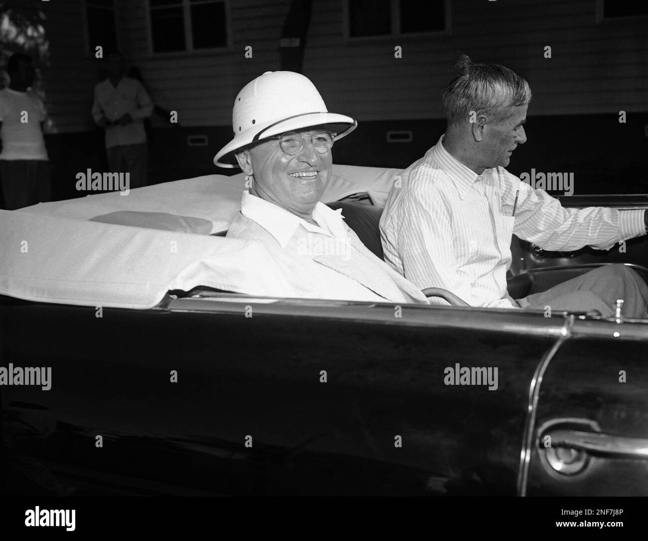 President Harry S. Truman, sporting a sun helmet outside the BOQ ...