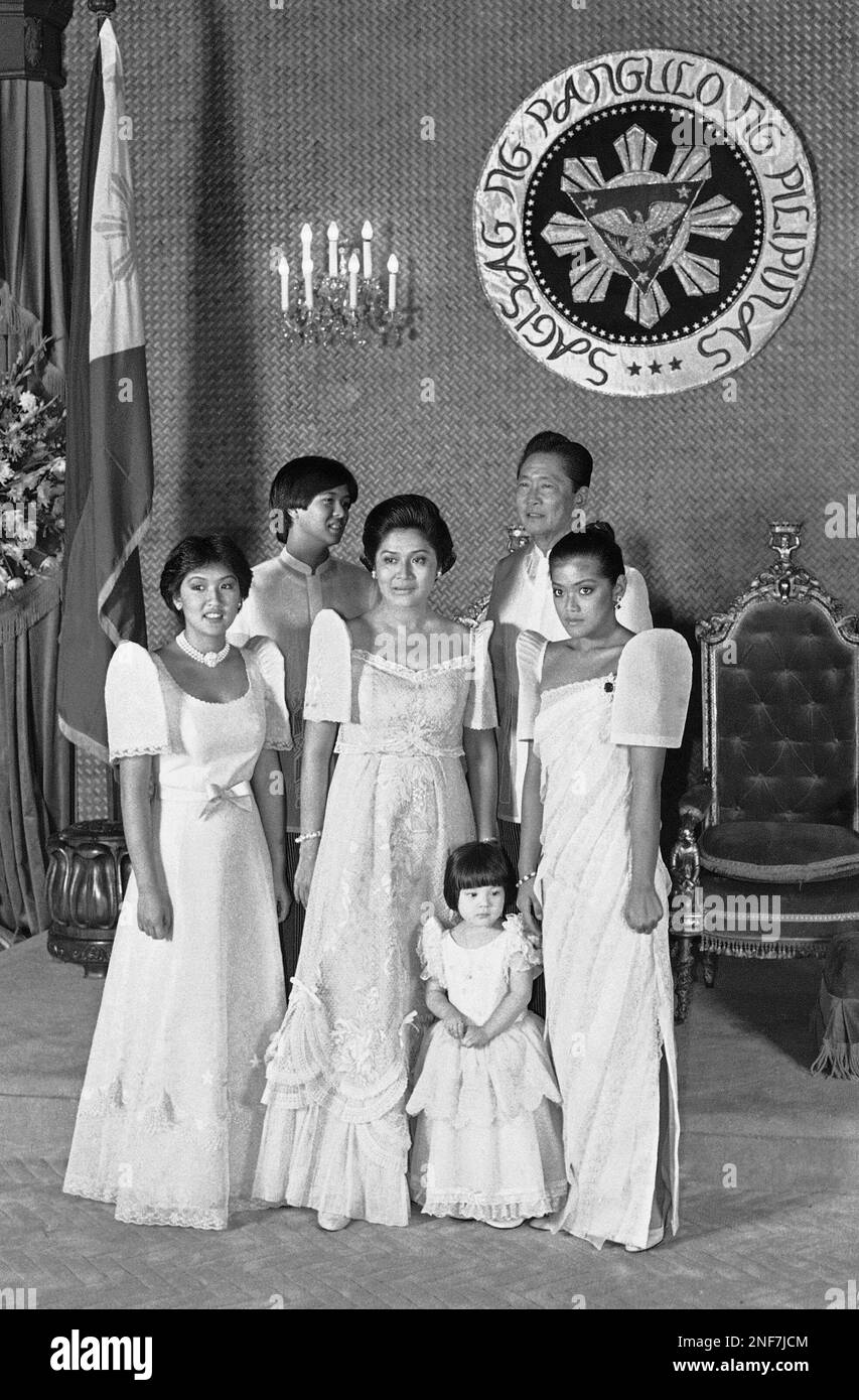 Philippine President Ferdinand Marcos, back right, and his wife Imelda Marcos, center, pose with ...
