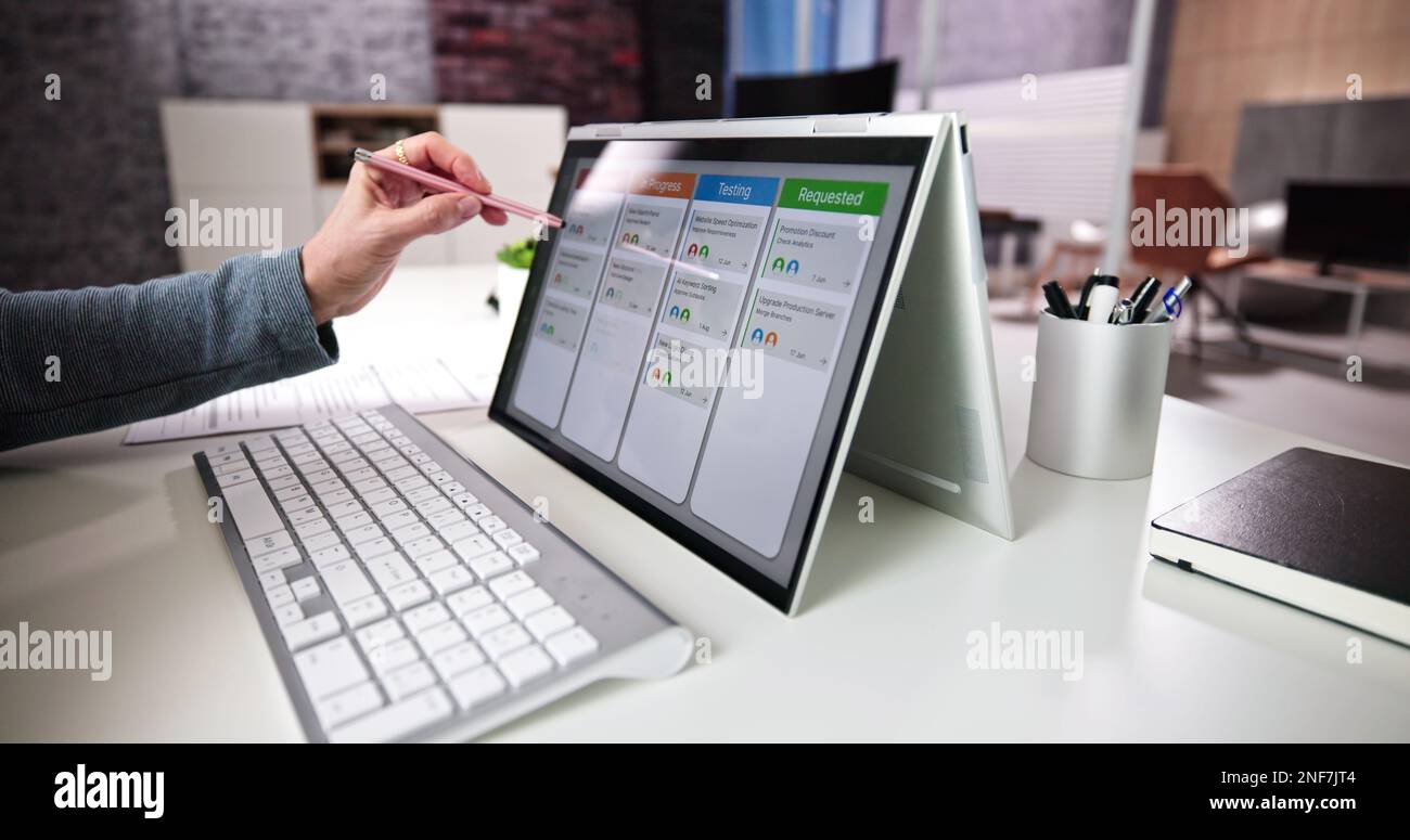 Project Manager Using Agile Software In Office Stock Photo - Alamy