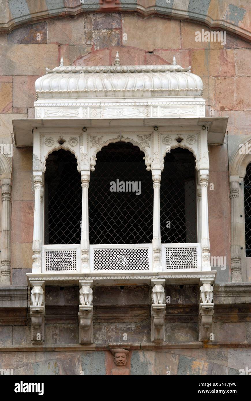 A decorative balcone carved in marbal at old palace of Indore state ...